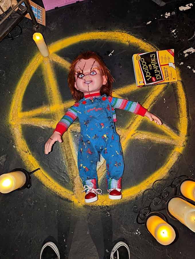 Good Guy gone bad gets the full occult treatment, surrounded by candles like he's auditioning for a séance.