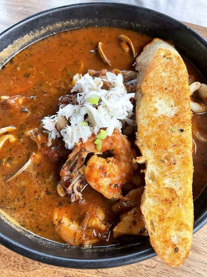 This bouillabaisse is what happens when the ocean decides to throw a party in a bowl and everyone shows up.