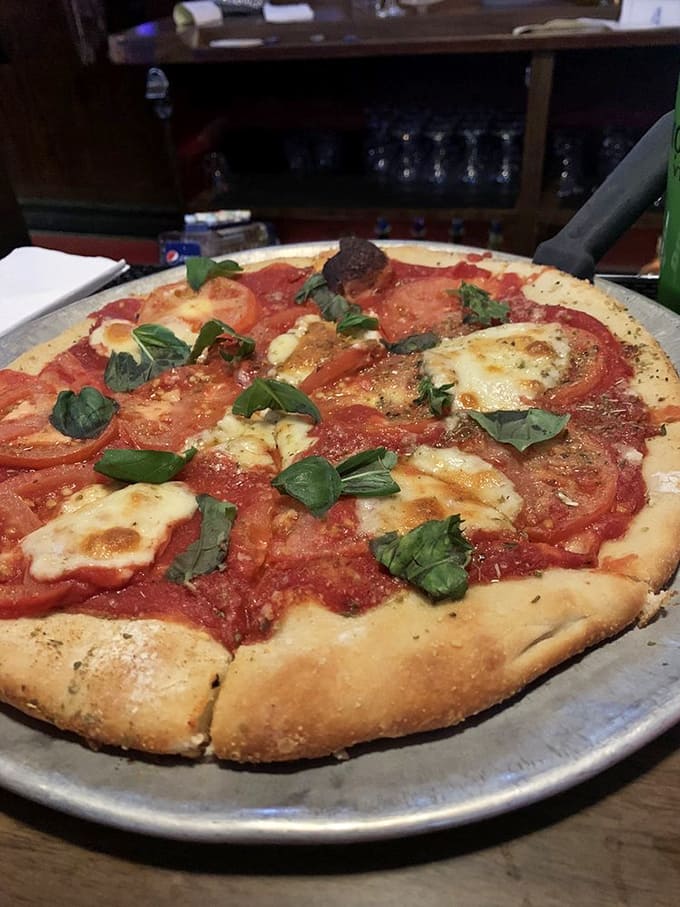 Fresh basil and tomatoes on a crispy crust—sometimes simple really is the most sophisticated choice.