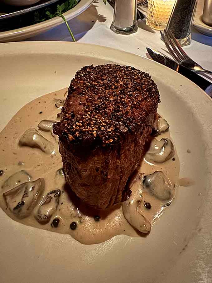 Filet mignon surrounded by mushroom sauce proves that simple elegance never goes out of style, just like Frank Sinatra.