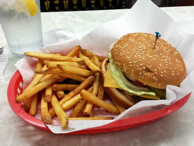 That glistening burger paired with crispy fries and creamy root beer is basically the Indiana trifecta of happiness.