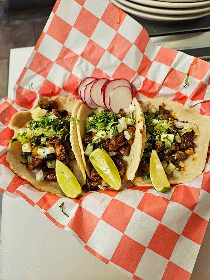 Tacos topped with fresh cilantro and lime wedges bring authentic Mexican flavors to your morning routine.