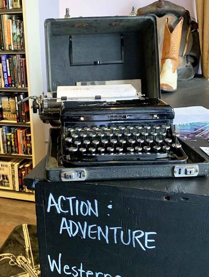 This vintage typewriter stands sentinel over the adventure section, a mechanical ghost from when writers hammered stories into existence.