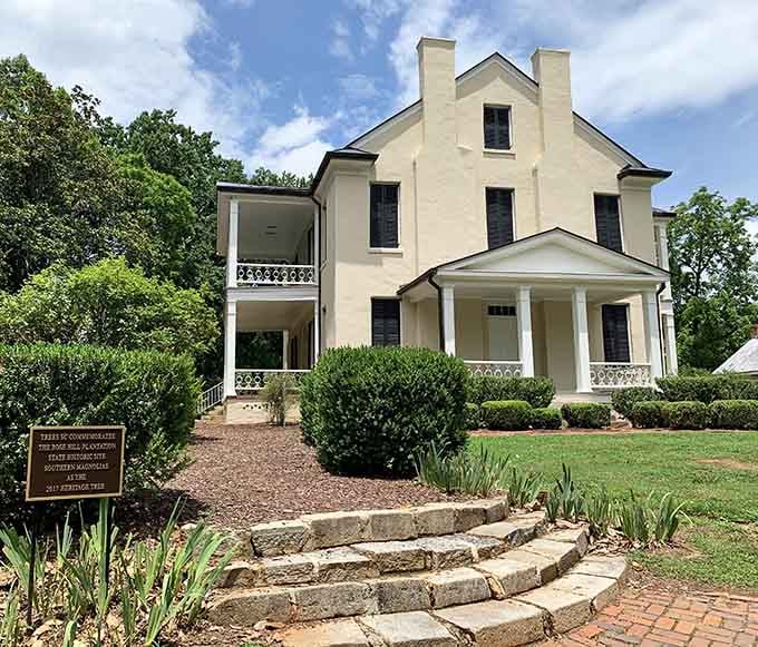 Rose Hill Plantation's elegant facade whispers stories from the 1820s, standing gracefully among mature trees and manicured grounds.