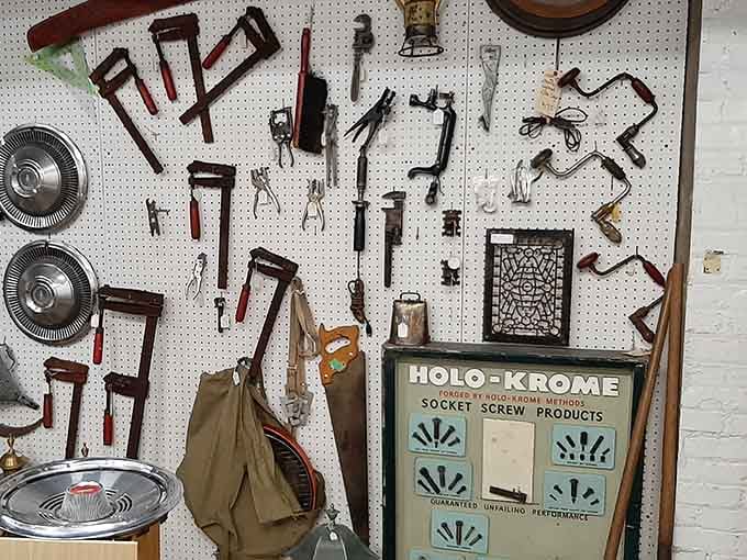A pegboard full of vintage hand tools that would make your grandfather nod approvingly and mutter something about quality craftsmanship.