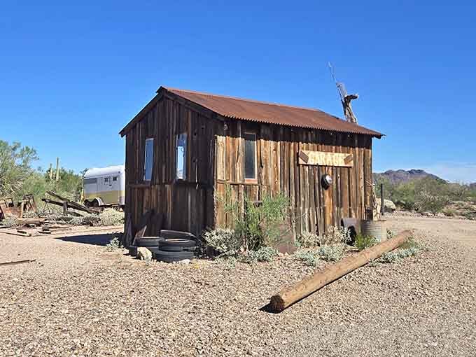 The weathered wood and corrugated metal of this structure have survived longer than most modern buildings will.