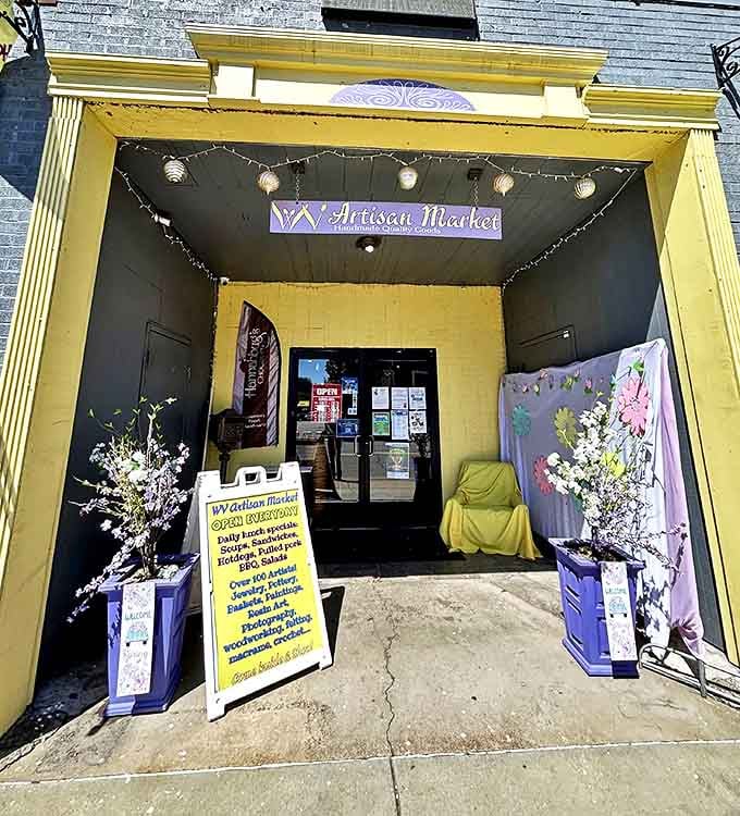 The WV Artisan Market's cheerful yellow entrance beckons like a ray of sunshine. Step inside to discover treasures crafted by local hands with mountain-inspired creativity.