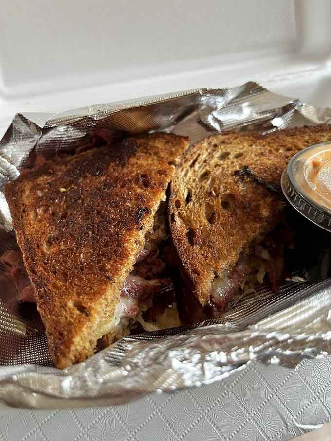 A Grilled Reuben that understands the assignment: melted cheese, tender corned beef, and toasted bread working in harmony.