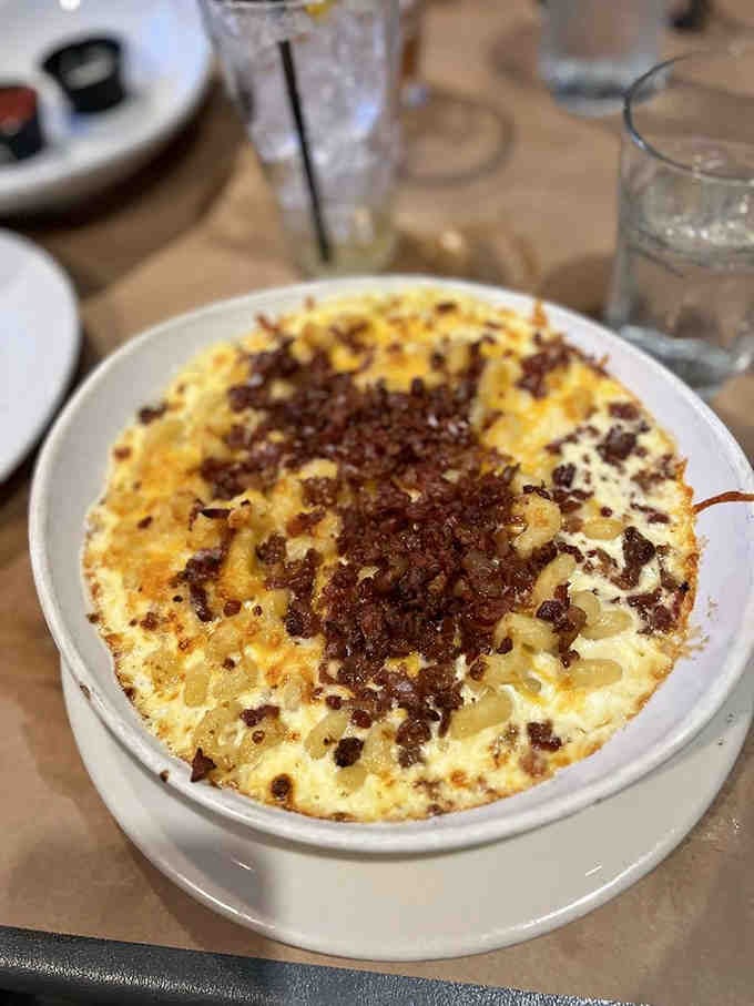 Bubbling, golden mac and cheese with a crispy bacon topping that would make your grandmother jealous.