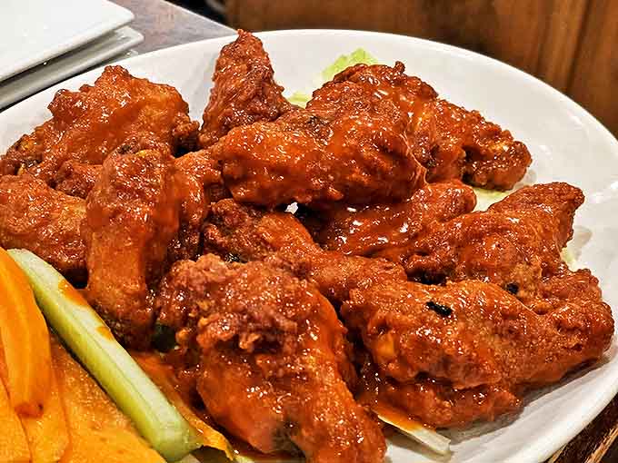Buffalo wings that don't mess around&mdash;saucy, substantial, and served with the traditional cooling agents. Your napkin will not survive this encounter.