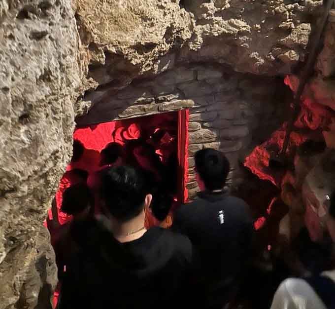 Red lighting transforms the cave tour into something straight out of a sci-fi movie, minus the aliens.
