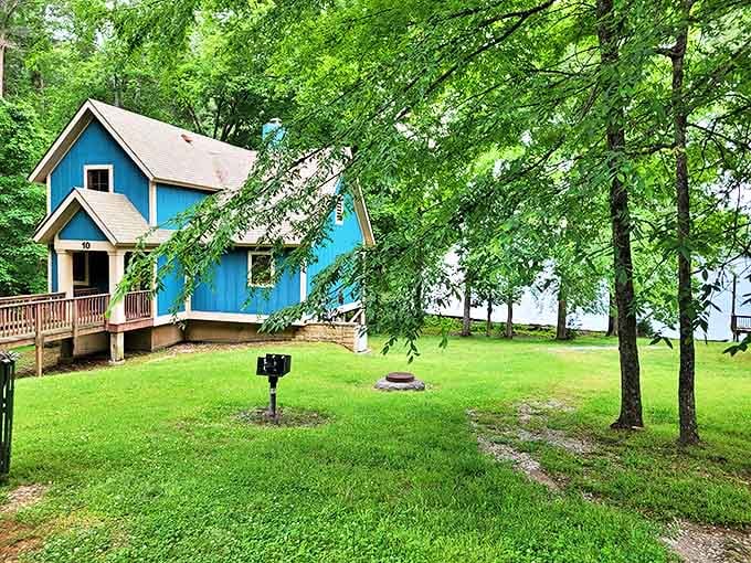 Lakeside living at its finest. These charming blue cabins nestle among the trees, offering a perfect blend of comfort and wilderness.