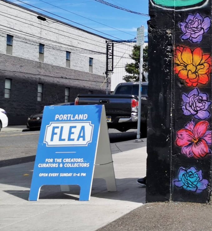 The blue Portland Flea sign stands as a beacon for the curious, promising Sundays filled with unexpected discoveries and creative inspiration.