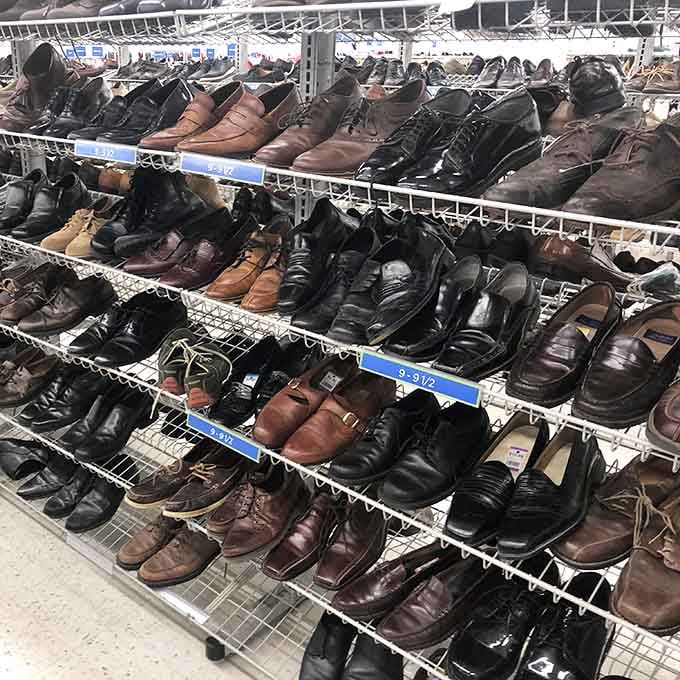 The men's shoe section: Where Italian leather loafers and practical work boots live in democratic harmony, waiting for their Cinderella moment.