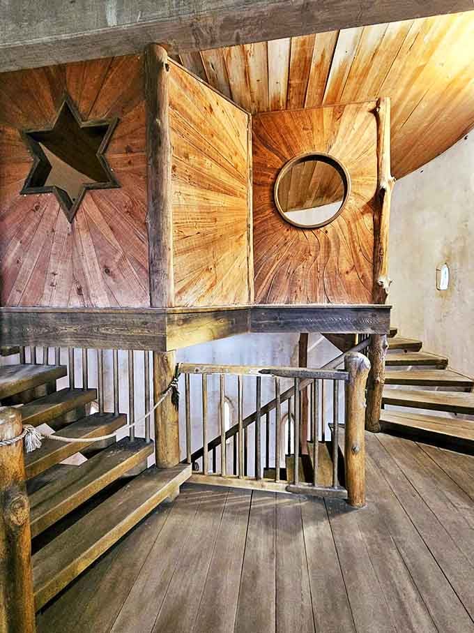 Woodwork that would make Hogwarts jealous&mdash;star-shaped cutouts and circular details transform functional passages into artistic statements high above the stone floor.