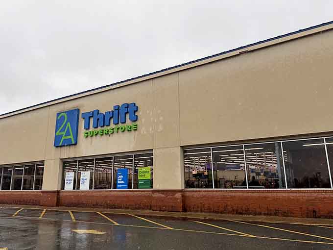 Rain-slicked pavement reflects this superstore's promise of endless aisles filled with secondhand treasures waiting to be discovered.