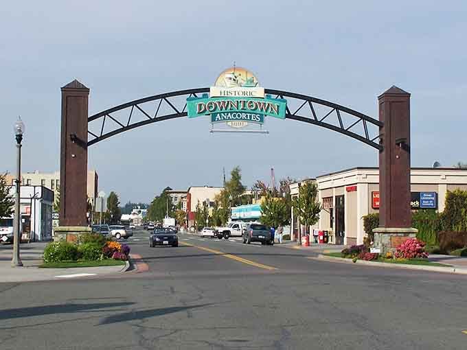 That welcoming arch frames a main street where community spirit still matters more than corporate chains and cookie-cutter development.