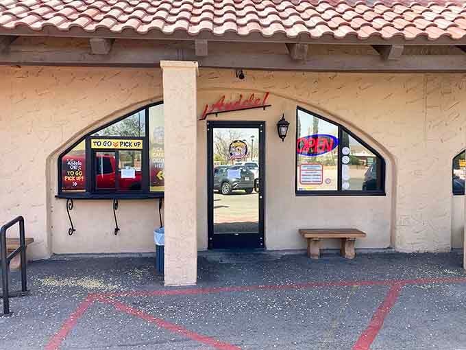 Andele's modest entrance conceals a salsa paradise within. That "Open" sign is your invitation to flavor country!