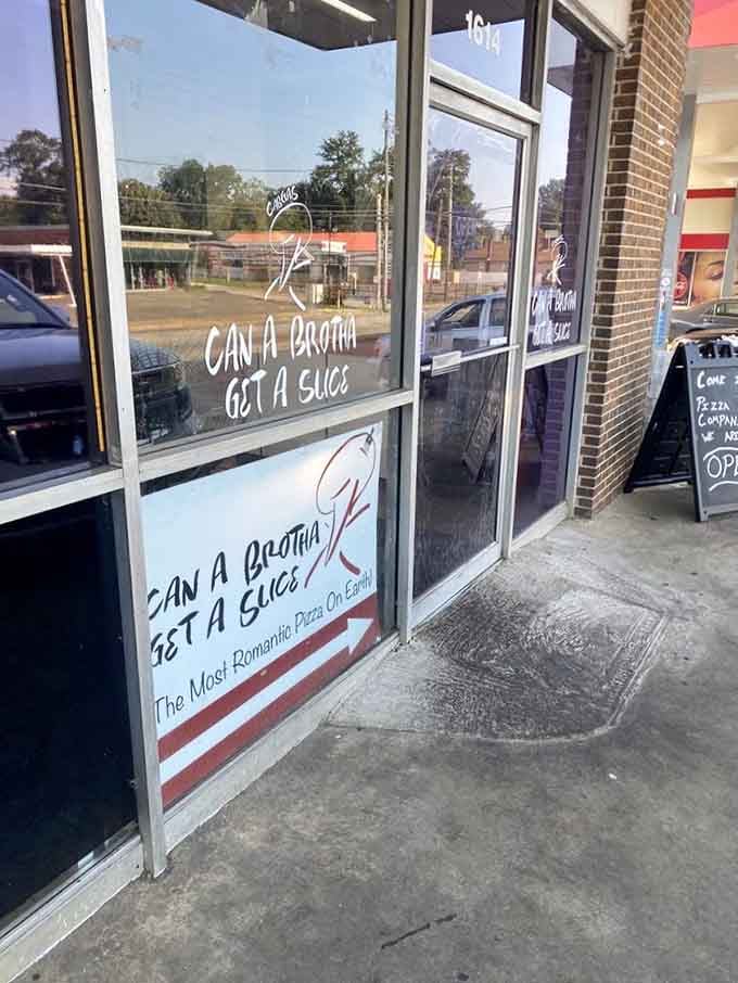"Can a brotha get a slice" might be the best pizza shop name in Alabama. The window promises "the most romantic pizza on Earth!"