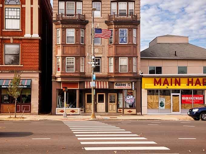 Bay windows and American flags create a quintessential New England scene, where Main Hardware still means something to the neighborhood.