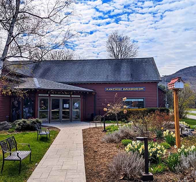 Spring flowers frame the entrance to this charming building housing the world's largest kaleidoscope inside.