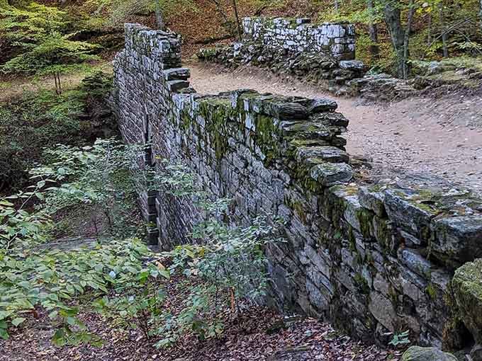 Moss-covered stones stacked without mortar still stand strong, proving old-school engineering beats modern shortcuts every single time.