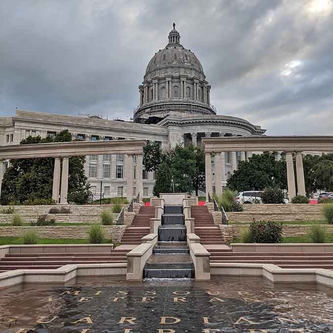 The majestic capitol dome rises through dramatic clouds, proving government buildings can still inspire awe and civic pride today.