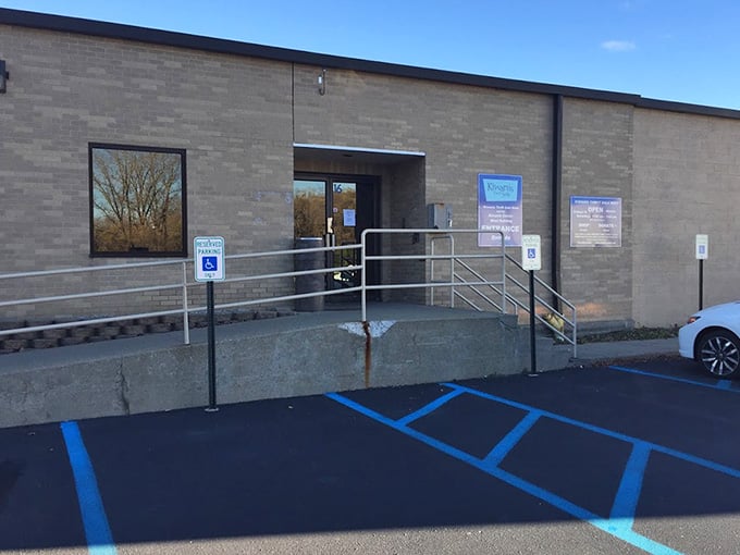 The accessible entrance with its modern ramp shows this community-focused shop welcomes absolutely everyone through its doors.