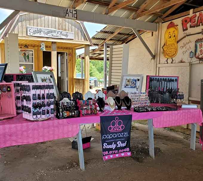 Pink displays pop against rustic wood, where jewelry and accessories sparkle like hidden gems waiting to be discovered.