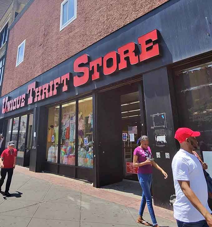 Shoppers stroll past the sleek black exterior like they're window shopping on Fifth Avenue, except everything costs about ninety percent less.