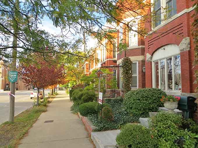 Sunset turns these brick storefronts golden, creating the kind of scene that makes you want to slow down completely.