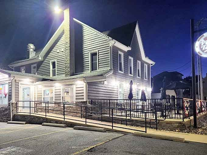 Small-town charm, big-time flavor! This converted house glows with promise as the evening sky turns that perfect pizza-craving blue.