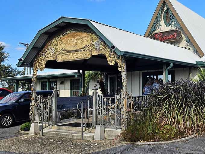 That carved wooden entrance isn't just decorative &ndash; it's your gateway to authentic Cajun flavors in Lafayette.