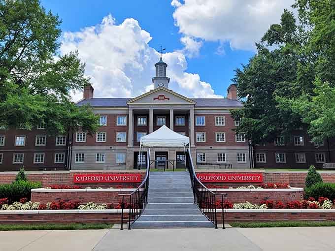 Red brick campus buildings under summer clouds create the kind of college-town atmosphere that keeps communities young and vibrant.