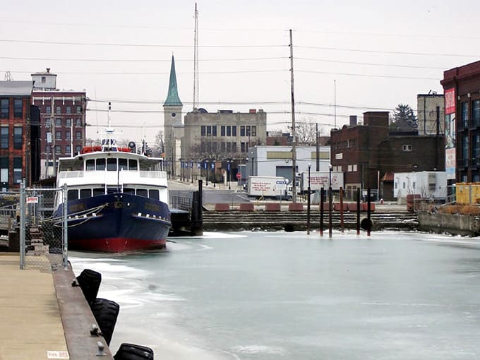 That classic vessel waiting patiently in ice reminds you that even Lake Erie takes a winter break sometimes.