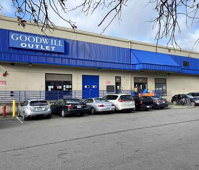 Bold blue warehouse exterior signals serious bargain territory where the adventurous dig through bins for golden discoveries.