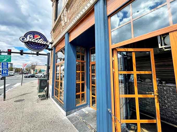 Sicilia's blue and white storefront whispers sweet Italian promises to every passing pizza lover.