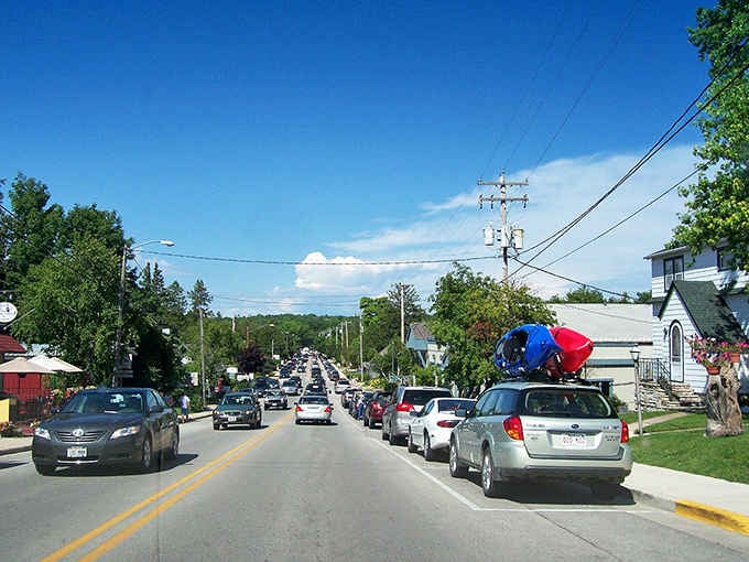 Summer traffic means kayaks on roof racks and anticipation in the air as vacationers chase that perfect lakeside sunset.