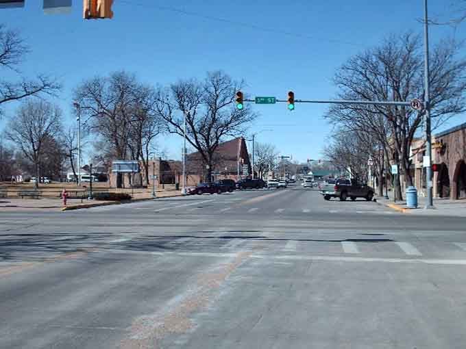 Winter transforms Main Street into a peaceful scene where heating costs are manageable and neighbors still wave hello.