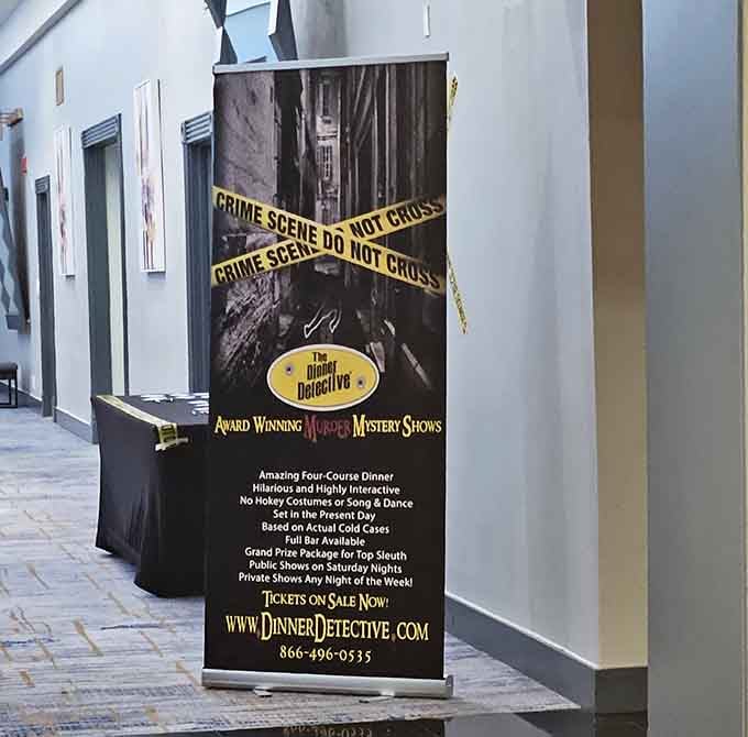 Crime scene tape and mystery await behind this banner—dinner theater meets detective work for an evening of intrigue.