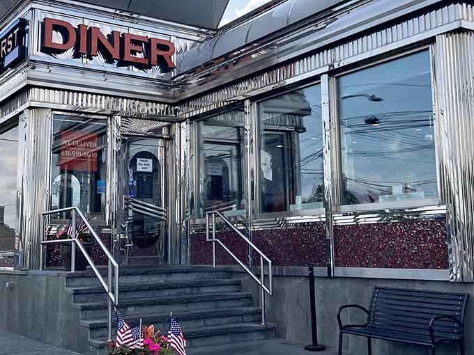 The Lindenhurst Diner's gleaming stainless steel exterior shines like a beacon of hope. Inside, home fries are achieving the perfect crisp-to-tender ratio.