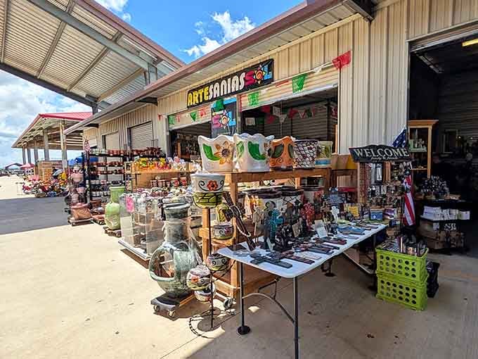 Artisan pottery and handcrafted treasures spill onto outdoor tables, proving the best finds often wait in unexpected sunny corners.