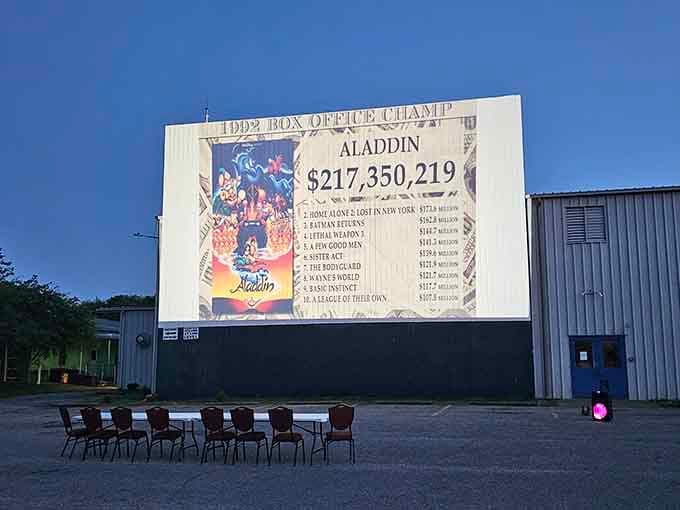 Box office numbers displayed proudly because even classic drive-ins appreciate when Aladdin makes serious magic happen.