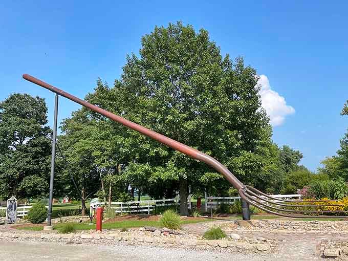 Farm tools get the supersized treatment! This enormous pitchfork gleams in the sunlight, ready for a haystack the size of a mountain.