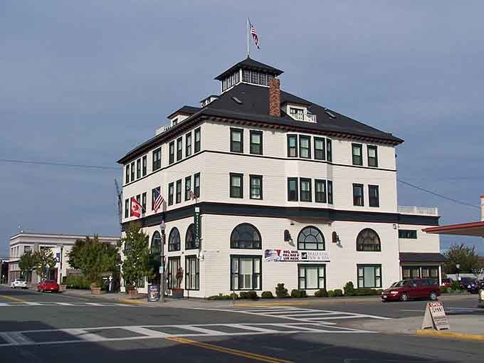 Classic maritime architecture stands white and proud, its cupola watching over the harbor like a lighthouse guiding ships home safely.