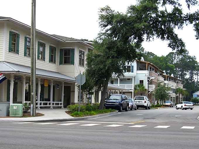 Modern storefronts nestled among old oaks show how progress and preservation can dance together when done right.