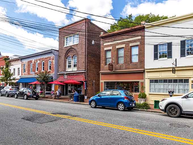 Main Street stretches between buildings where local shops thrive and parking spaces are actually available most days.