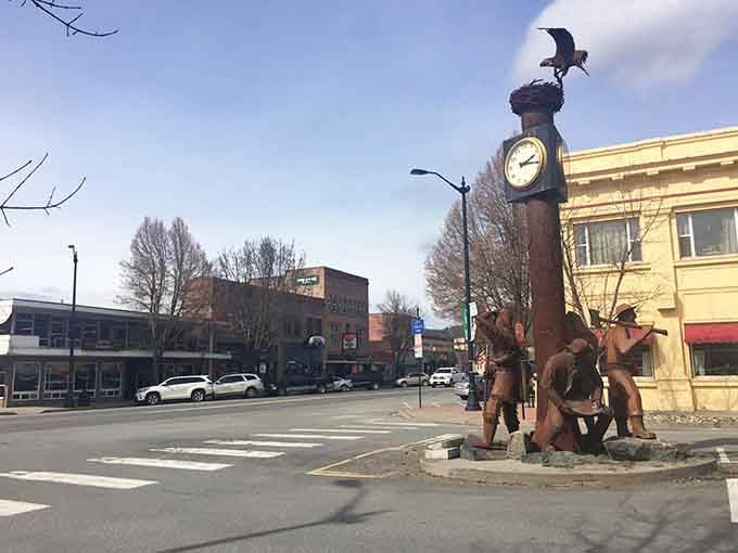 Metal sculptures of working folks honor the hands that built this town, standing watch over modern-day main street.
