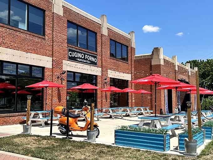The industrial-chic brick building houses Neapolitan pizza perfection. That orange Vespa adds the perfect Italian touch to the outdoor scene.