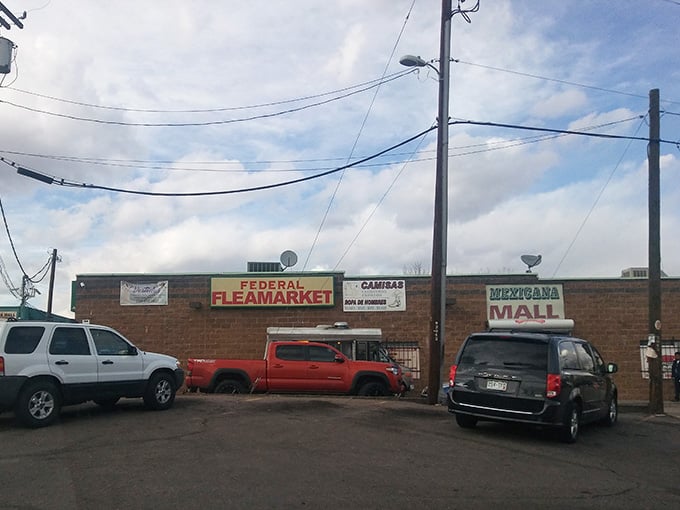 Multiple storefronts share this building, creating a mini marketplace of diverse vendors under one roof.